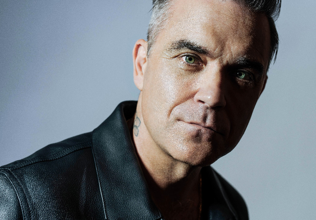 INTERVIEW. Robbie Williams viert 25 jaar solocarrière: “Papa zijn is ...