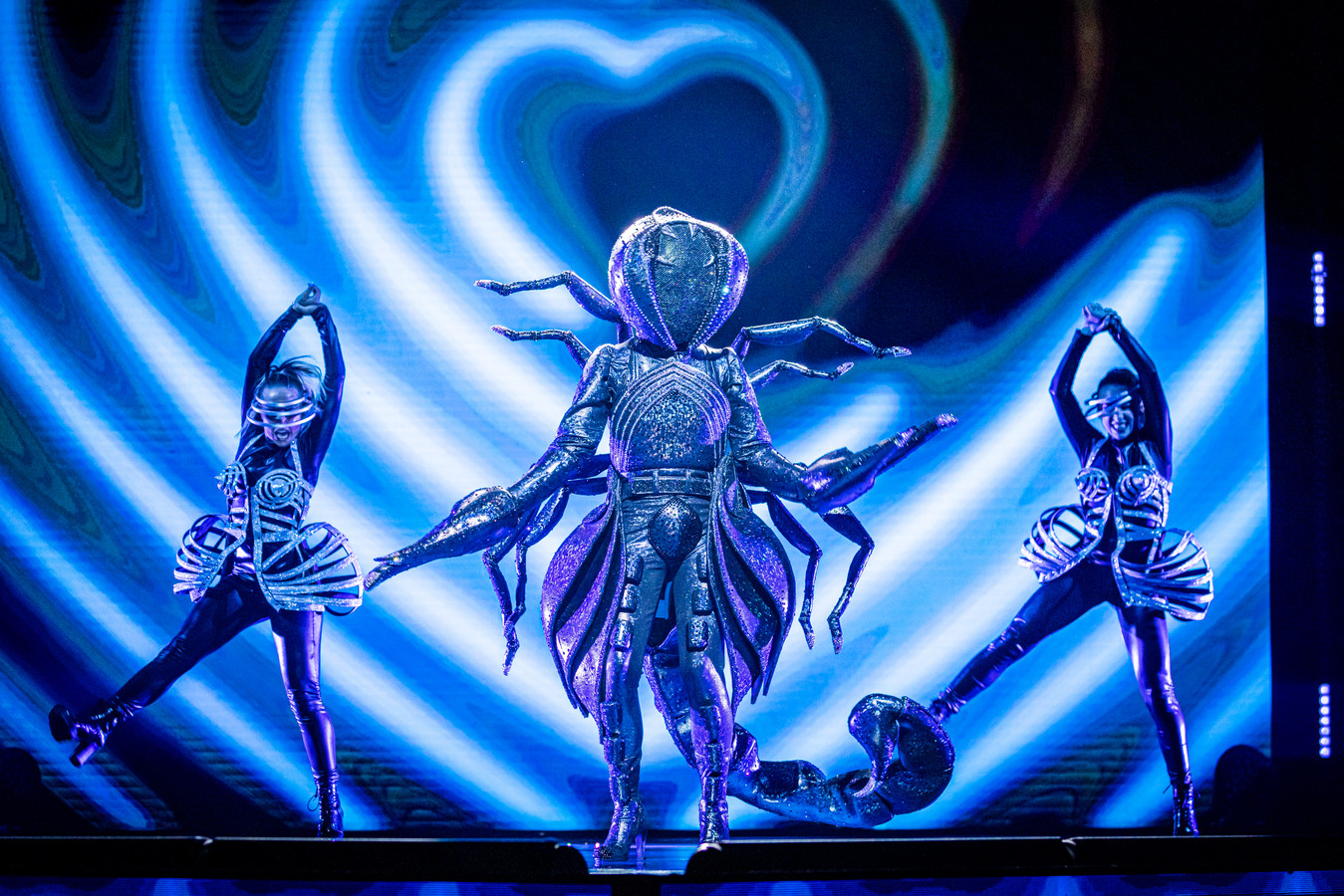 Bekijk hier de ontmaskering van Schorpioen én alle optredens uit ‘The ...